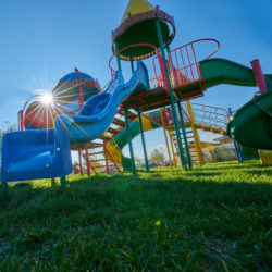 Swing on playground in a sunny day - newarta